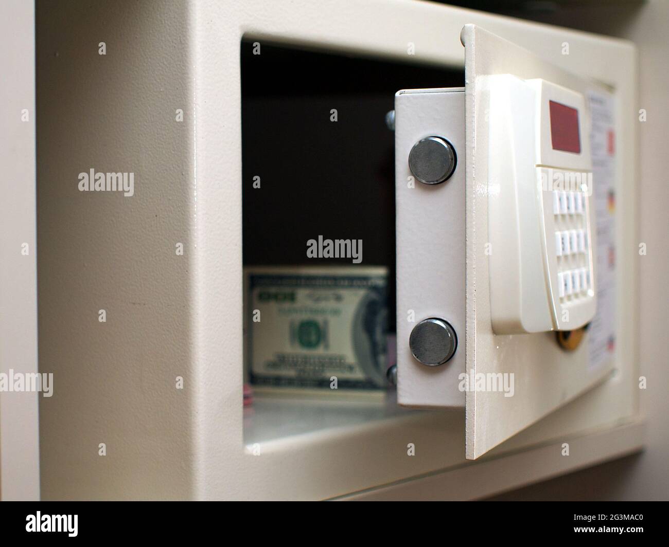 slightly open safe box closeup with banknotes inside Stock Photo - Alamy