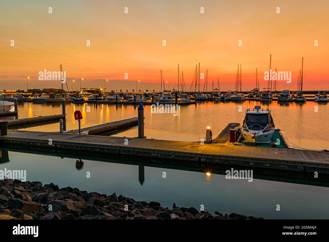 Evening harbour view with sunset Stock Photo - Alamy