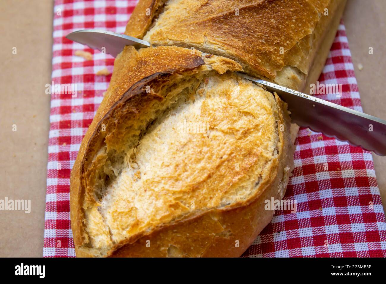Whole grain and sourdough bread, cut in half. Fresh bread on the table ...
