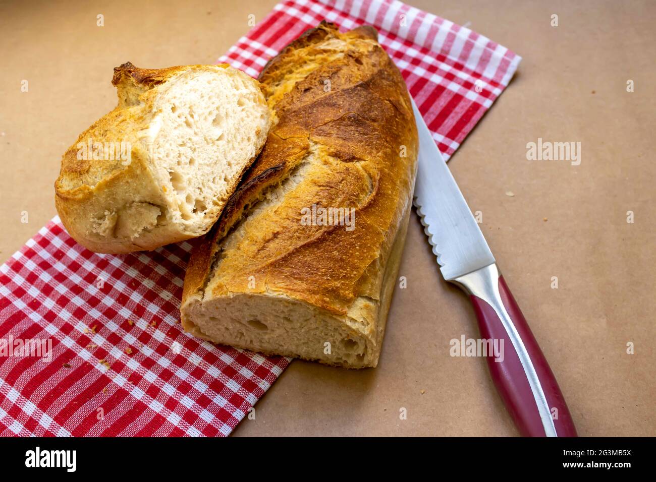Whole grain and sourdough bread, cut in half. Fresh bread on the table ...