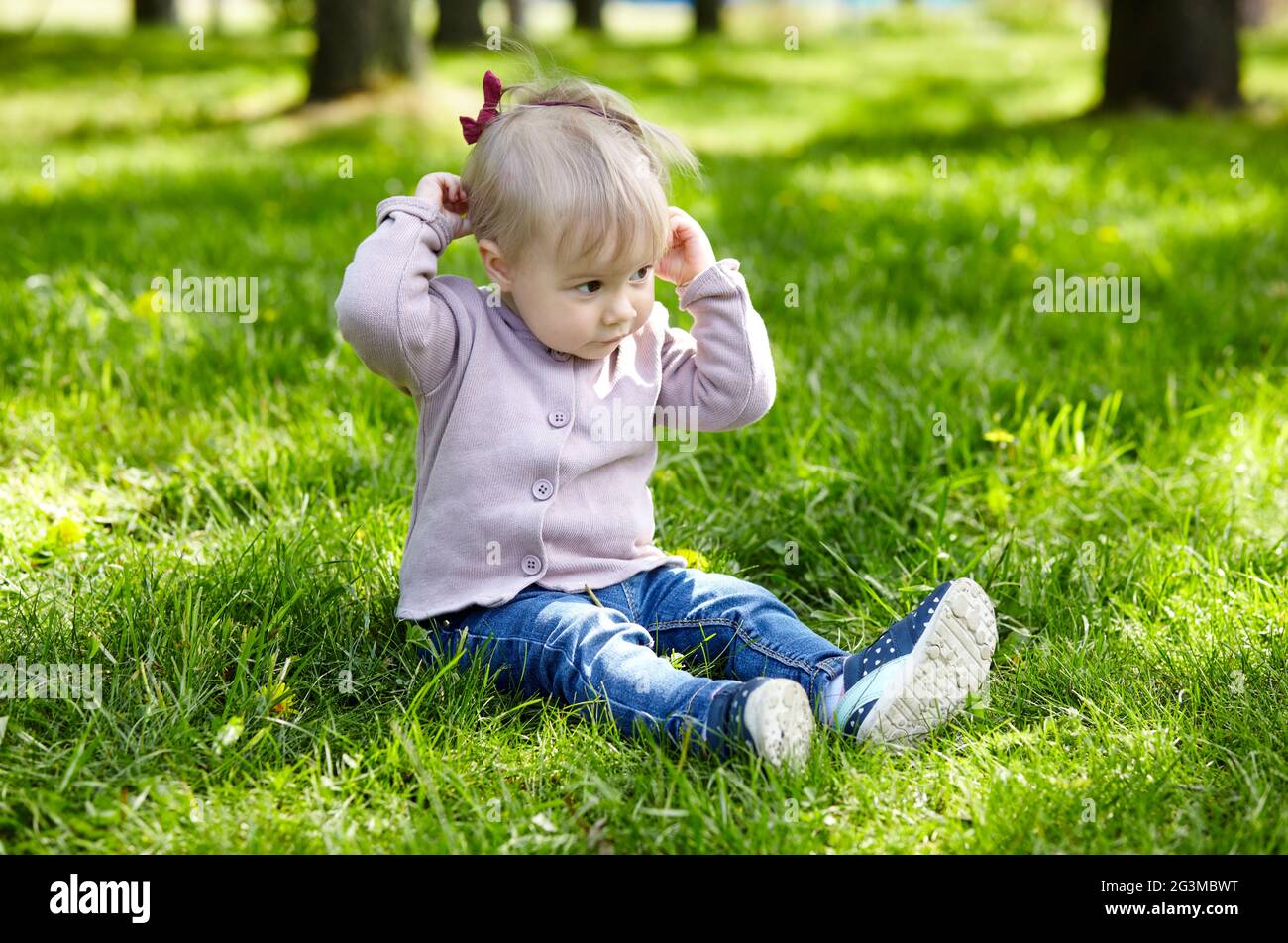 Little girl play in the park and have a good time. The concept of a ...