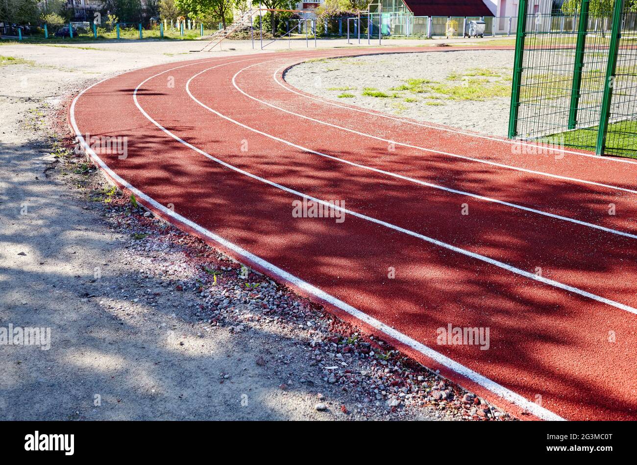 Red treadmill on sport field. Running track on the stadium Stock Photo ...