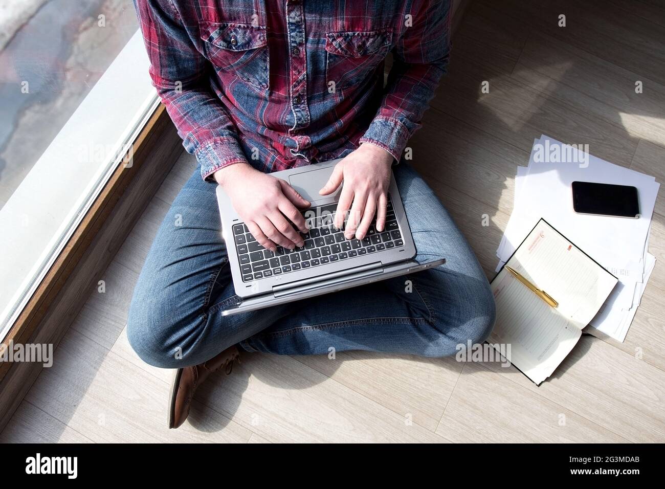 Young guy working on computer at home Stock Photo - Alamy