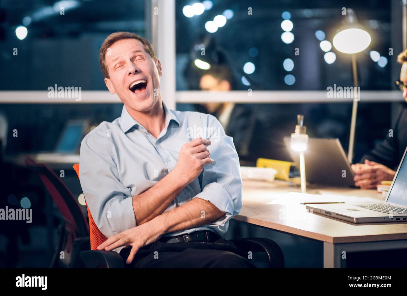 Laughing businessman hi-res stock photography and images - Alamy