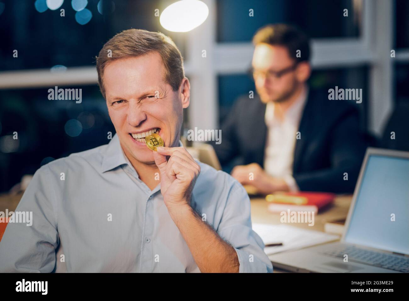 Biting coin hi-res stock photography and images - Alamy