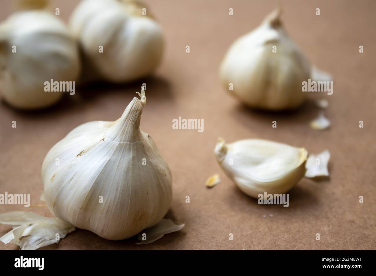 Close-up garlics on rustic background.Garlic is one of the most popular ...