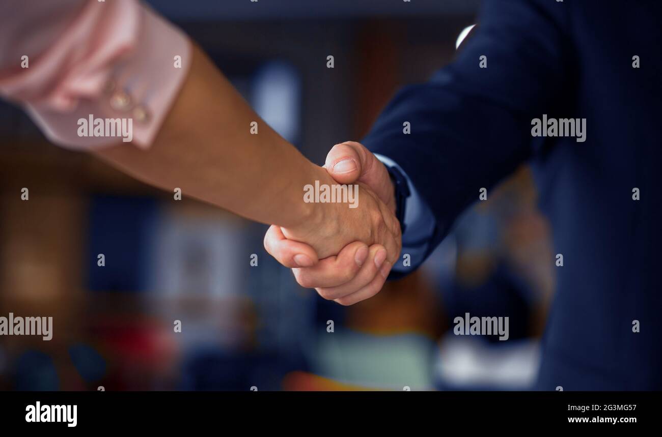 Business partners shaking hands symbol hi-res stock photography and ...