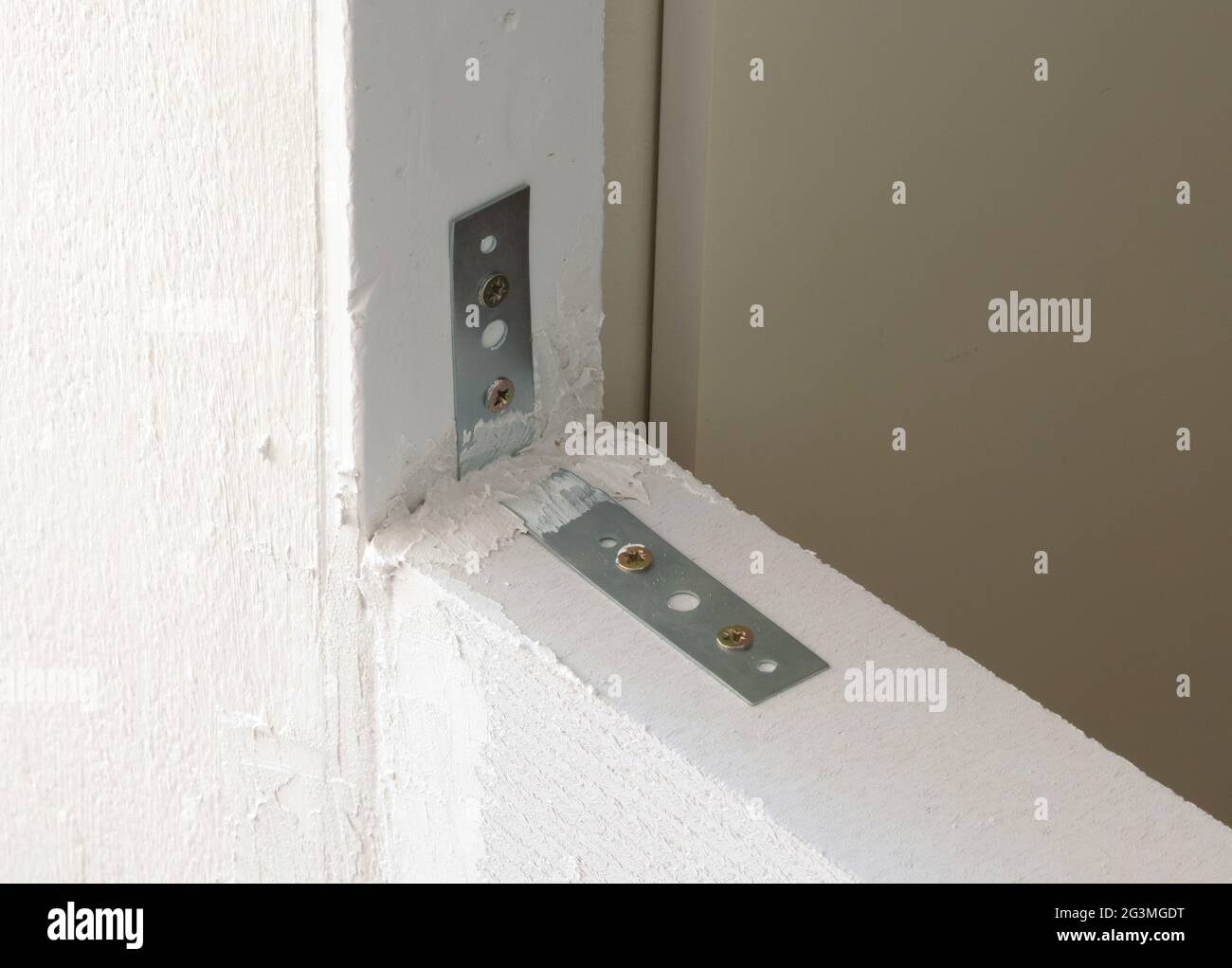 Building a small wall with lightweight concrete blocks Stock Photo - Alamy