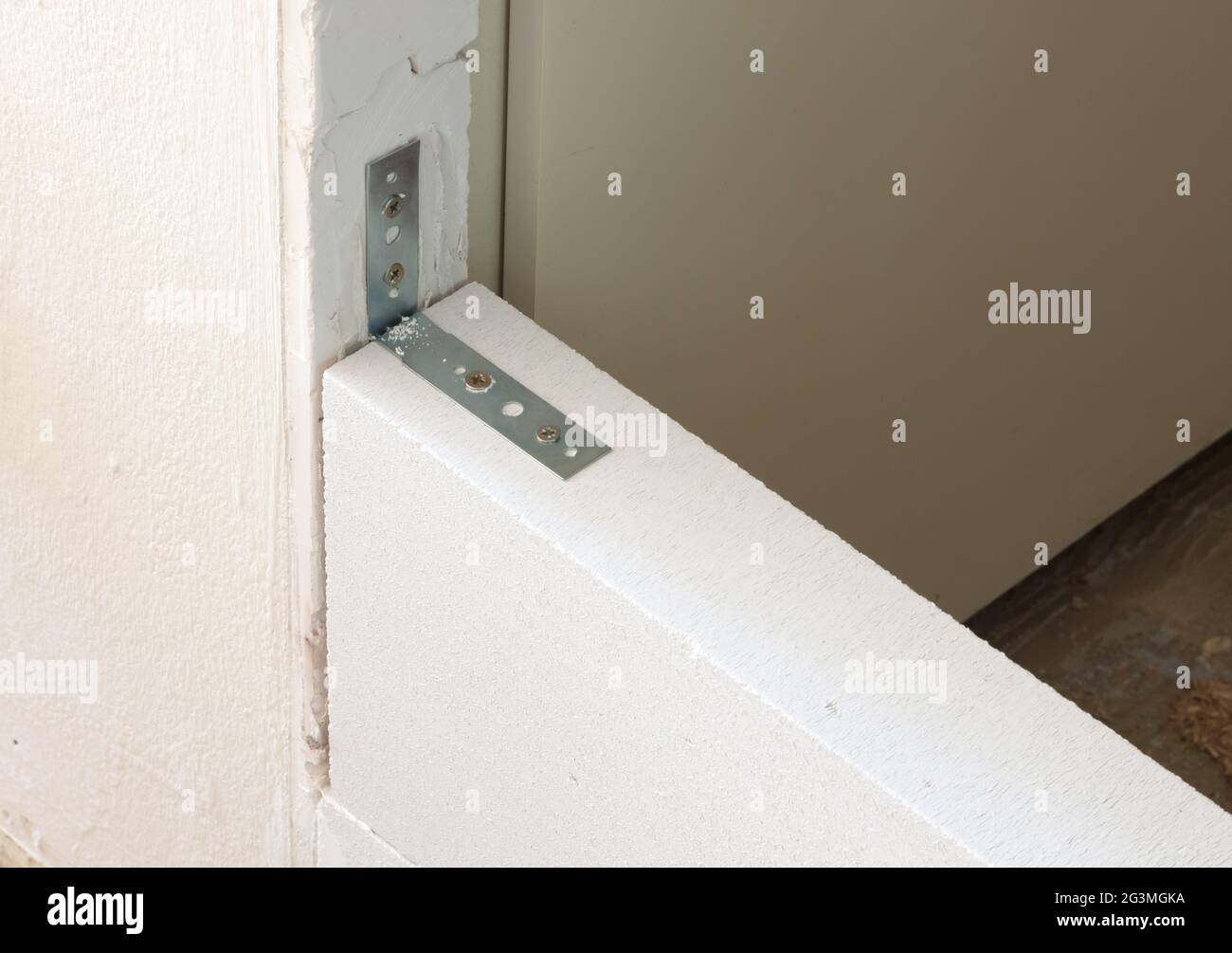 Building a small wall with lightweight concrete blocks Stock Photo - Alamy