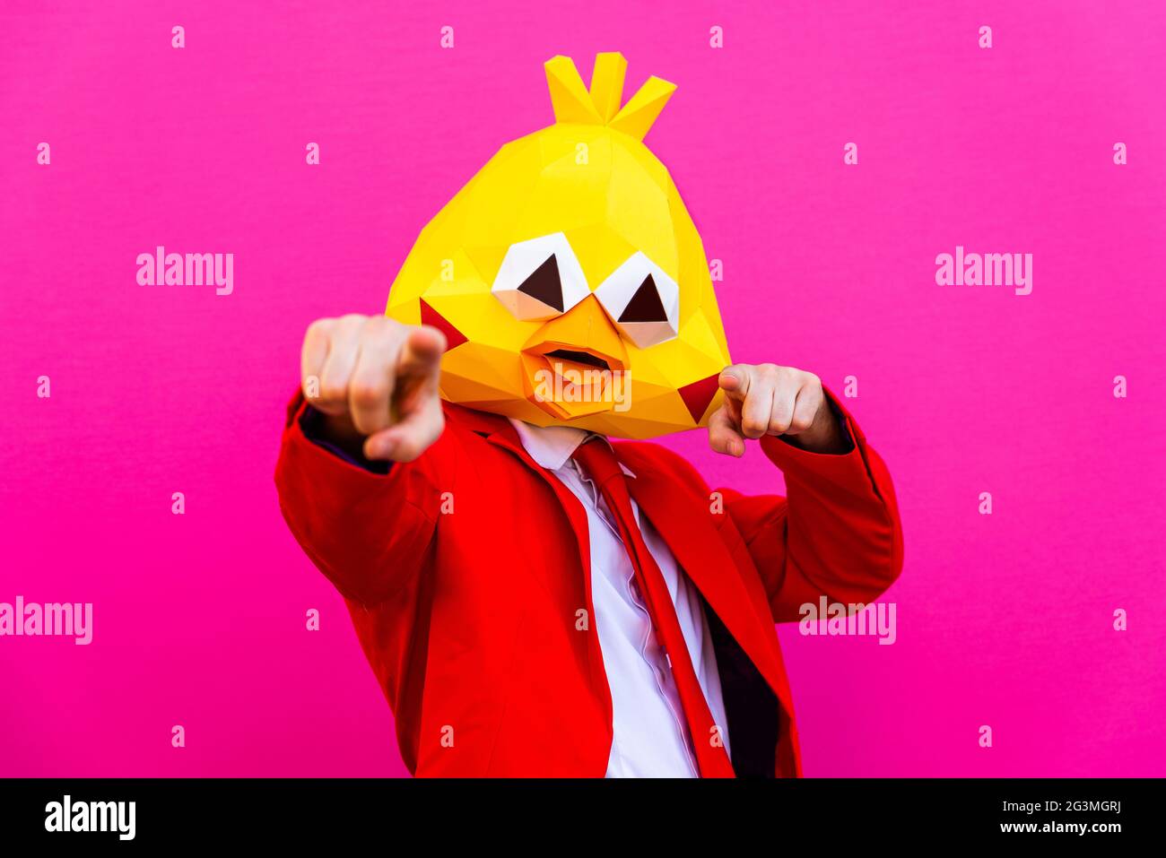 Cool man wearing 3d origami mask with stylish colored clothes ...