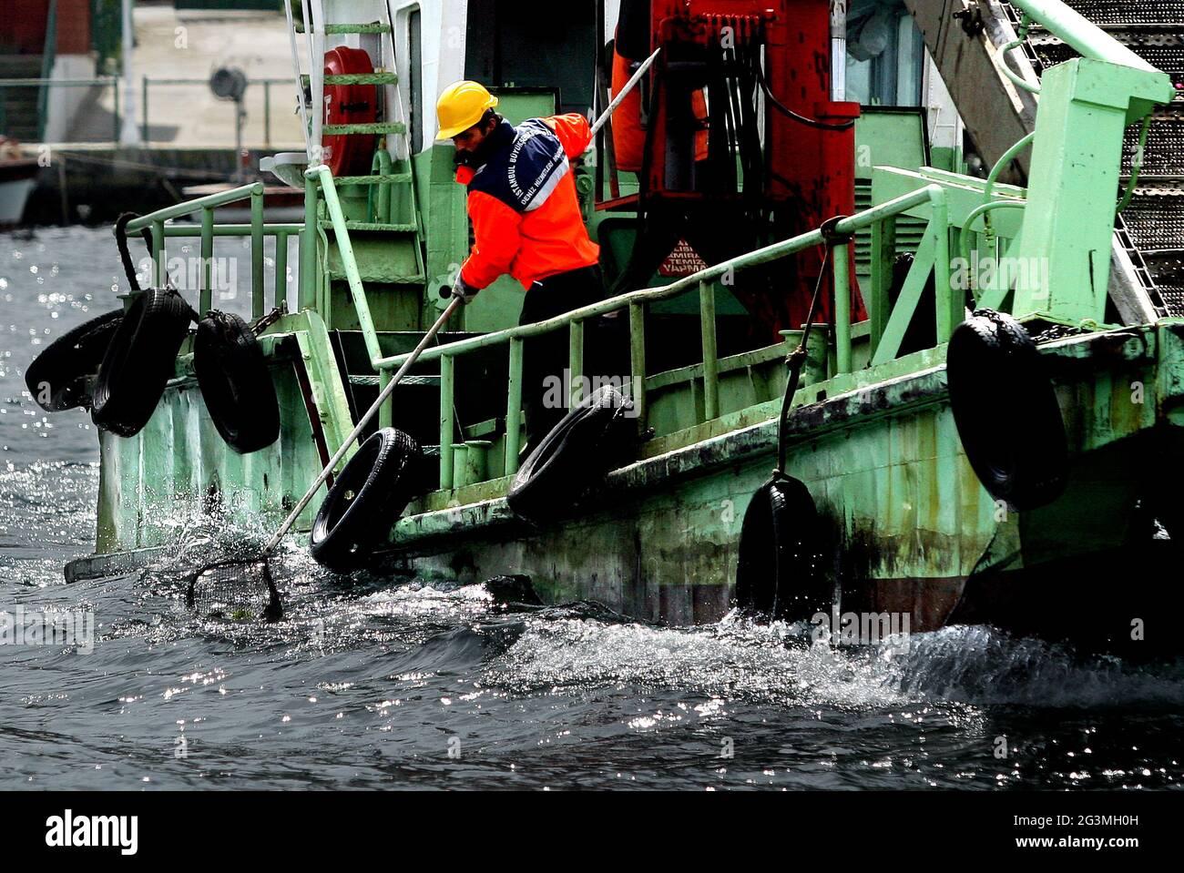 trash skimmer boat cleaning the water surface of the Bosphorus Strait ...