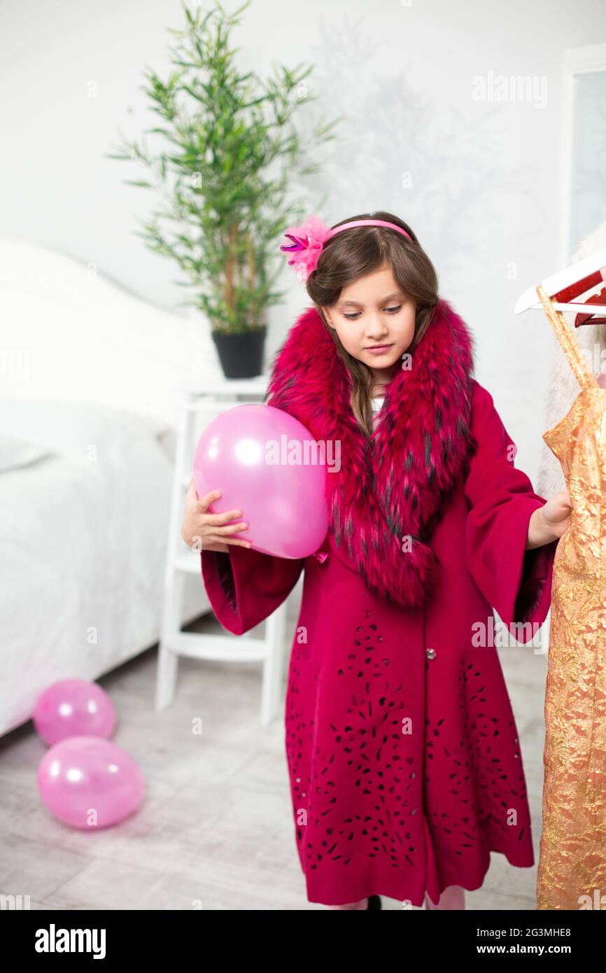 Cute girl playing dress up Stock Photo - Alamy