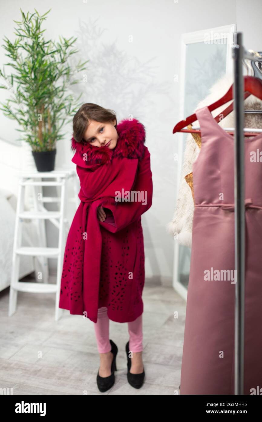 Cute girl playing dress up Stock Photo - Alamy