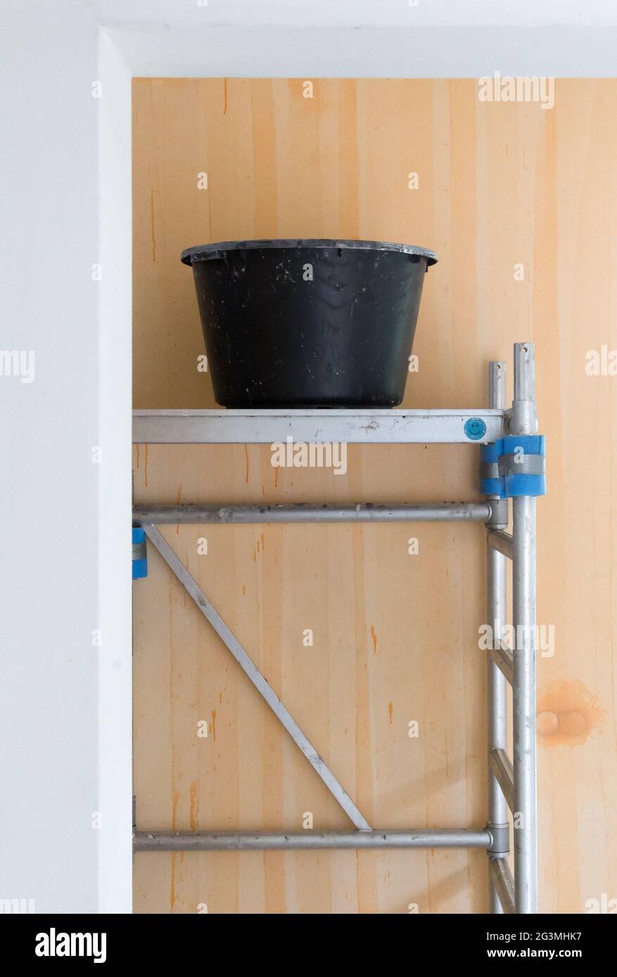Worker tools - Bucket standing on rolling scaffolding Stock Photo - Alamy
