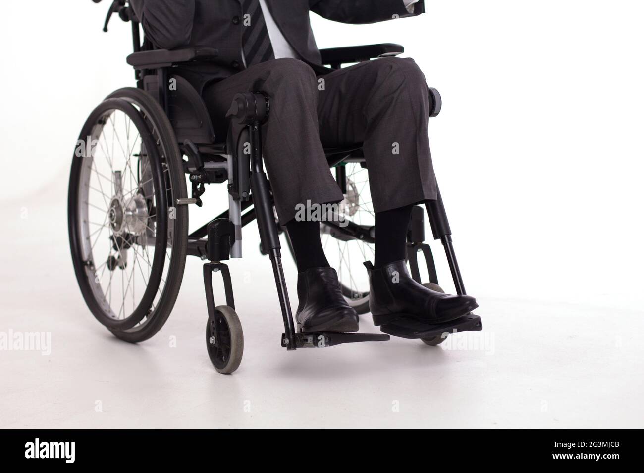 Disabled man in wheelchair in suit Stock Photo - Alamy