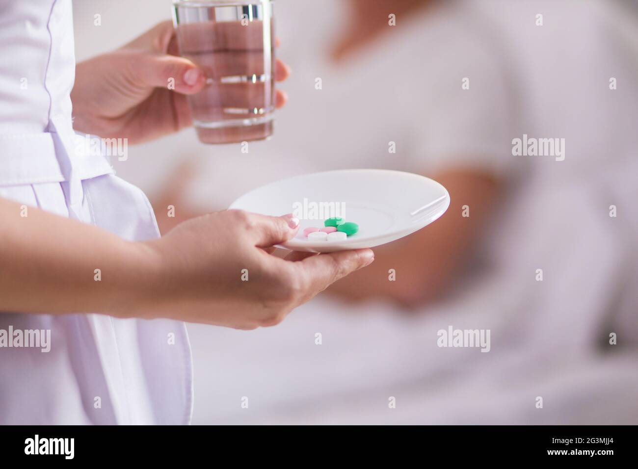Nurse giving medication Stock Photo - Alamy