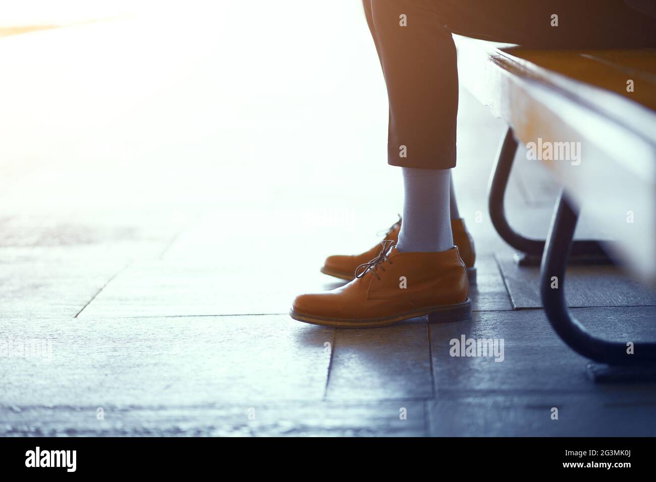 Feet of businessman at metro station Stock Photo - Alamy