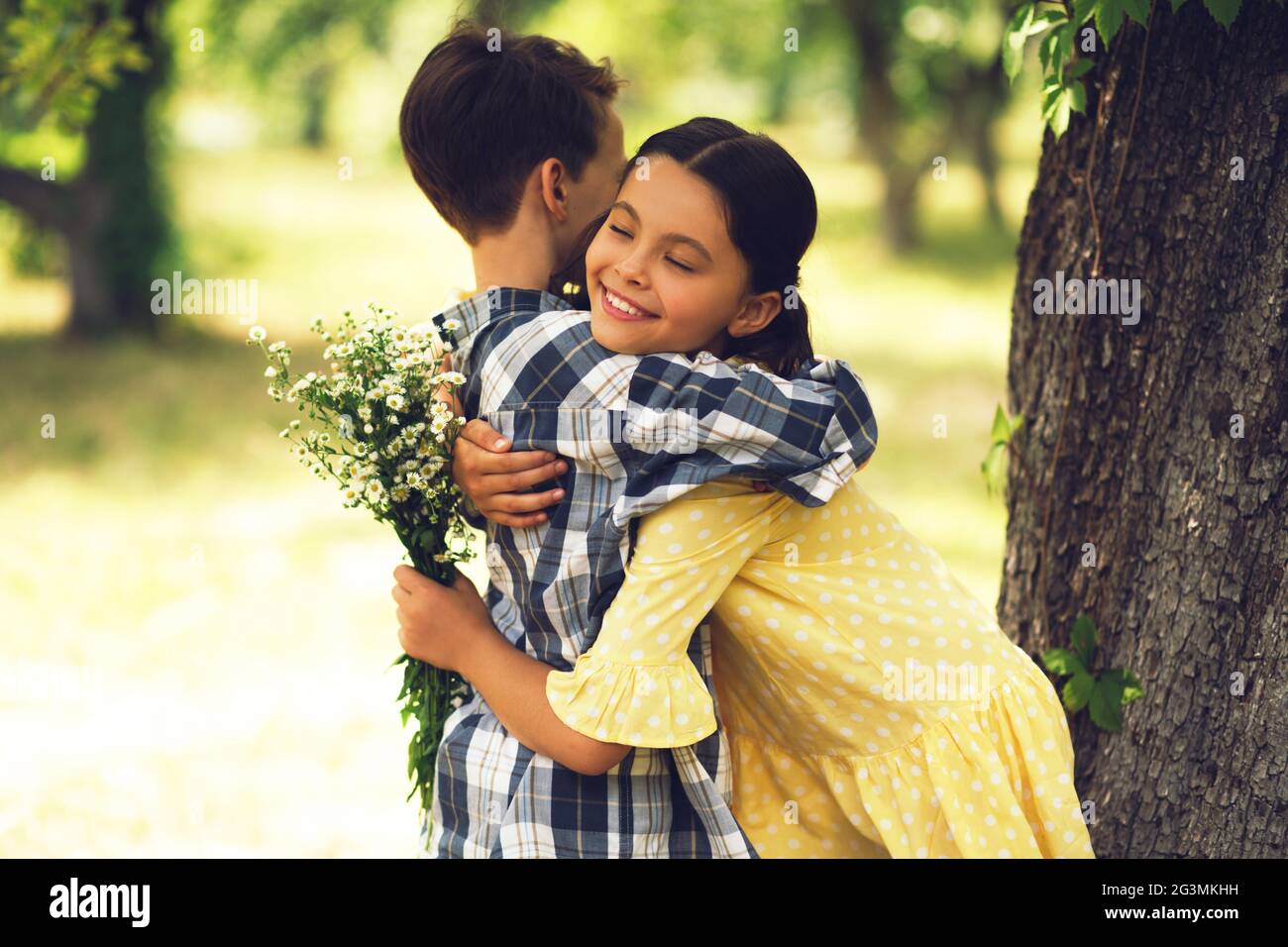 Boy giving flower girl hi-res stock photography and images - Alamy