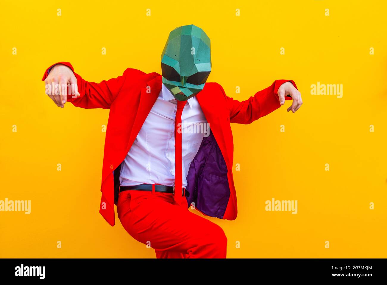 Cool man wearing 3d origami mask with stylish colored clothes ...