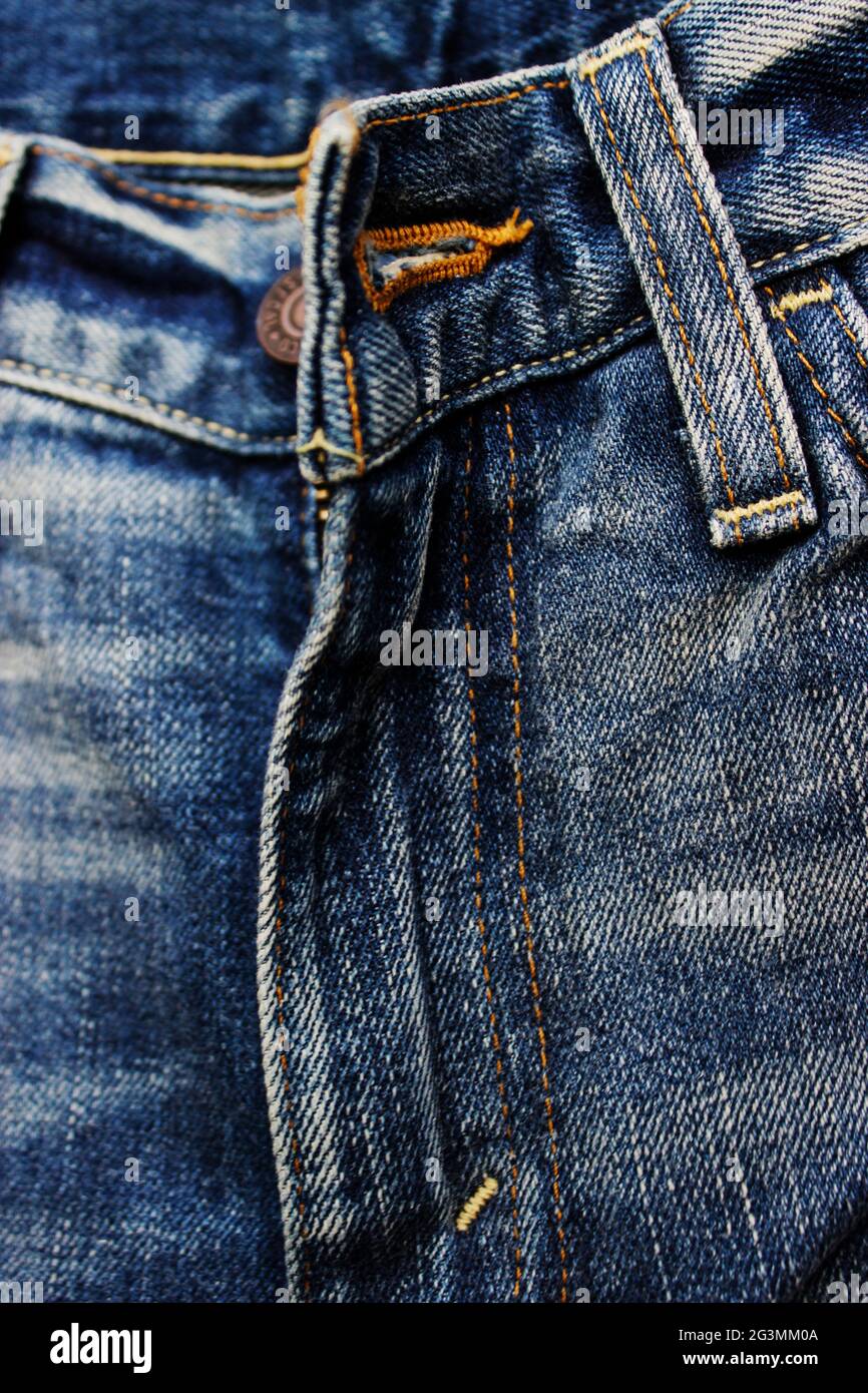 Close up of denim jeans front button.Texture and textile of opened pair ...