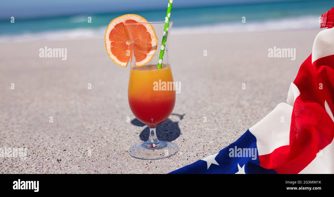 Composition of american flag and cocktail on beach Stock Photo - Alamy