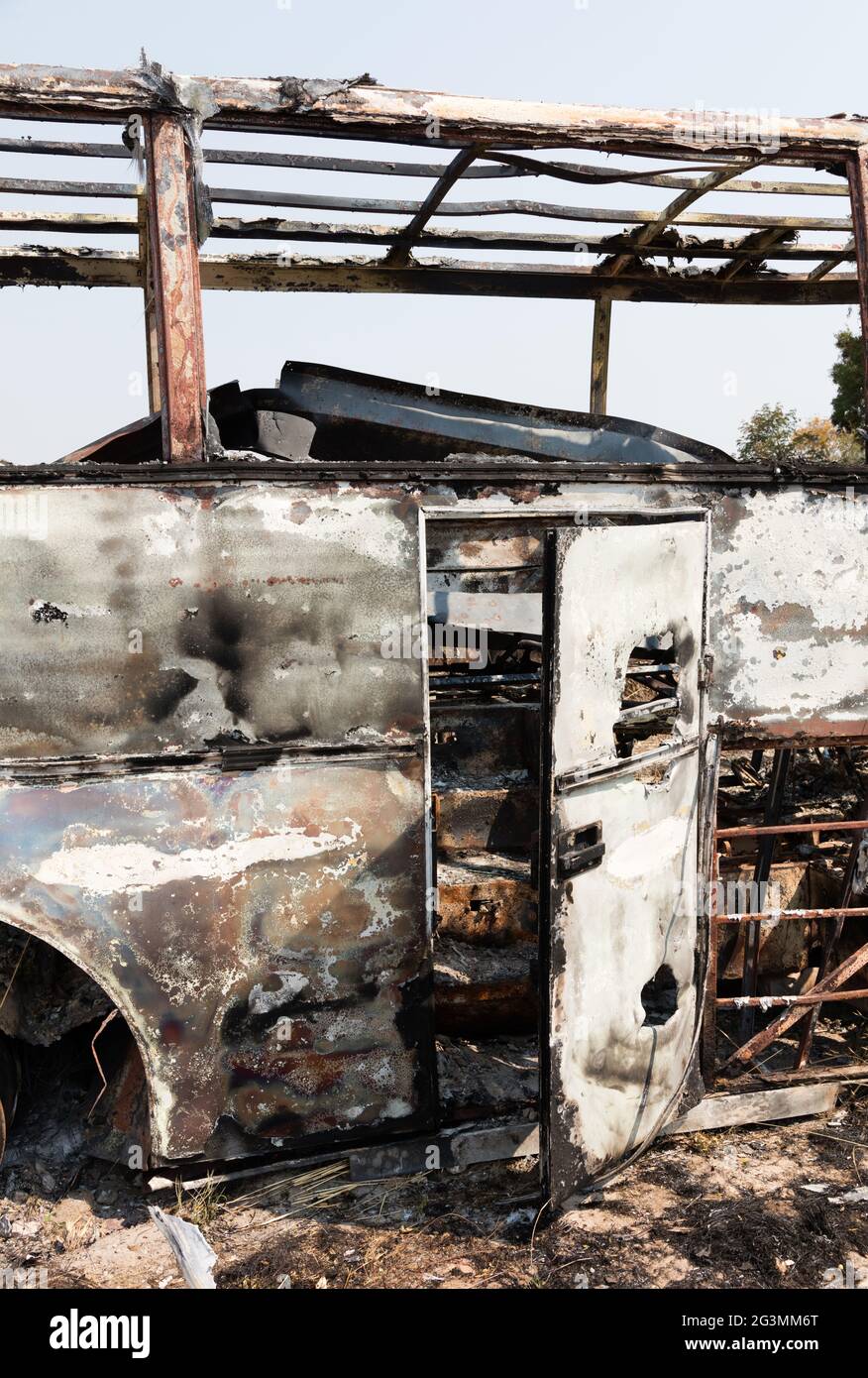 Burned bus at the side of the road, door Stock Photo - Alamy