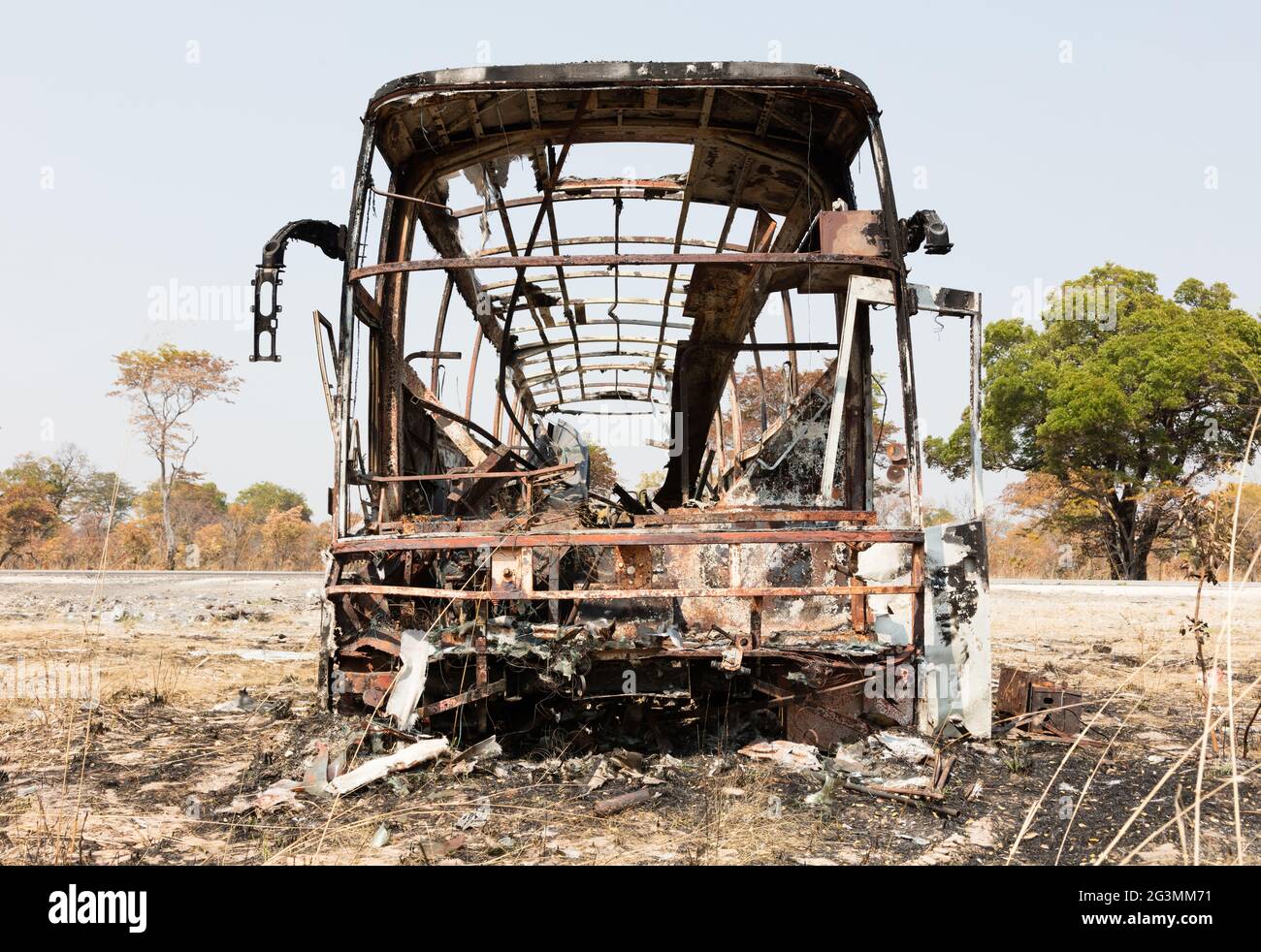 Burned bus at the side of the road Stock Photo - Alamy