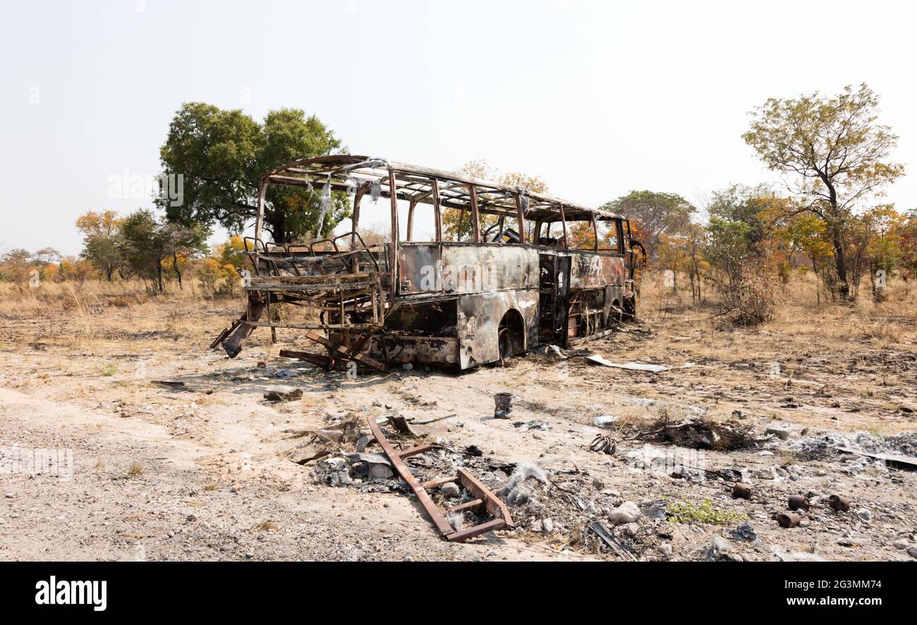 Burned bus at the side of the road Stock Photo - Alamy