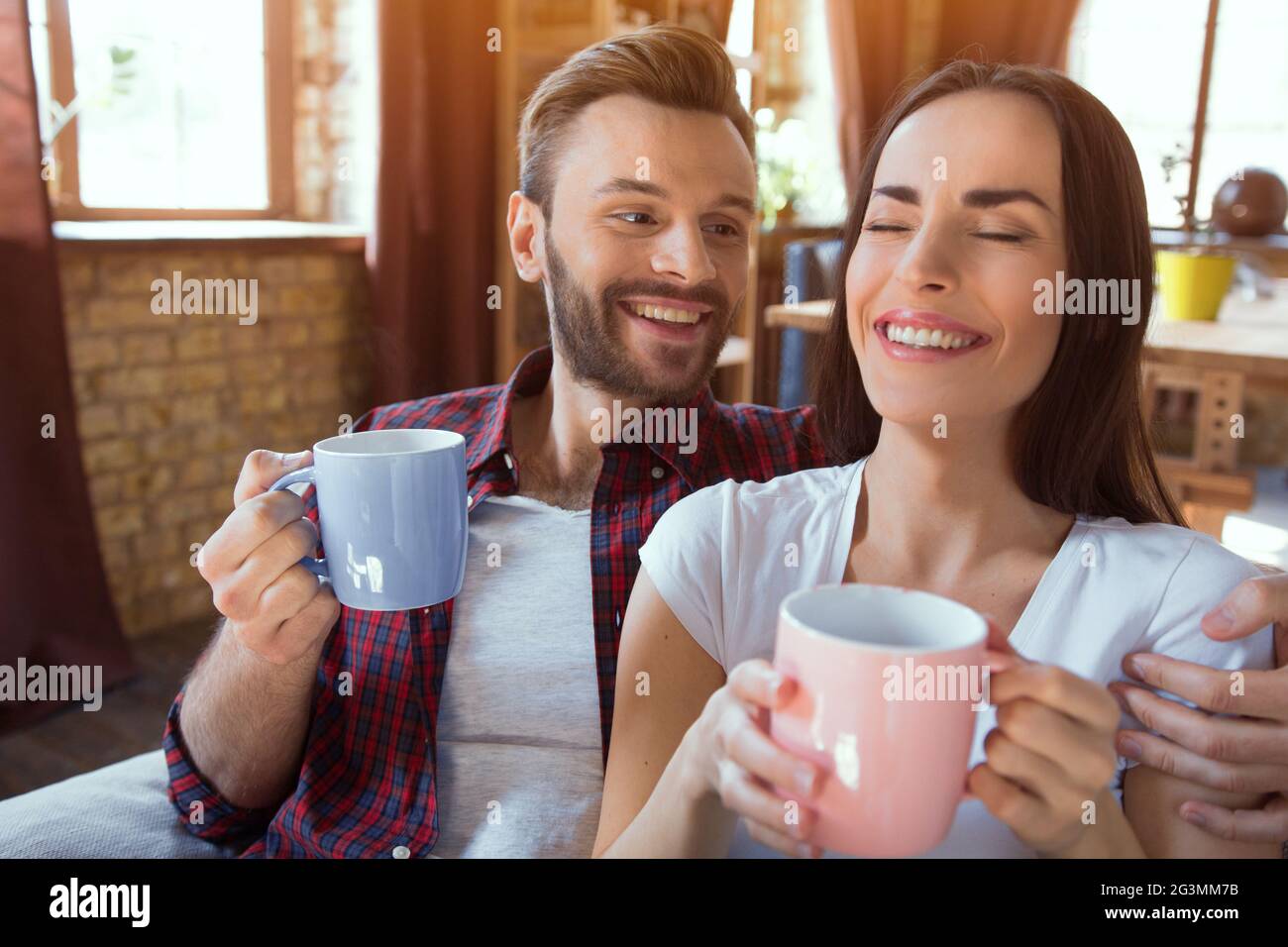 Lovely couple drinking coffee together Stock Photo - Alamy