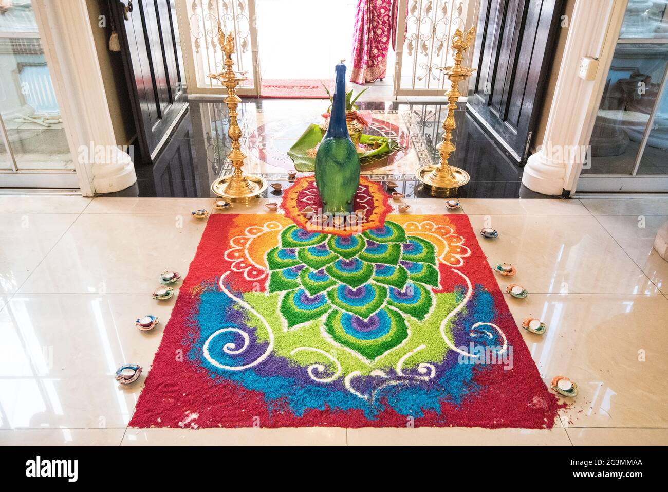 Beautiful rangoli (kolam) at an Indian Hindu wedding Stock Photo - Alamy