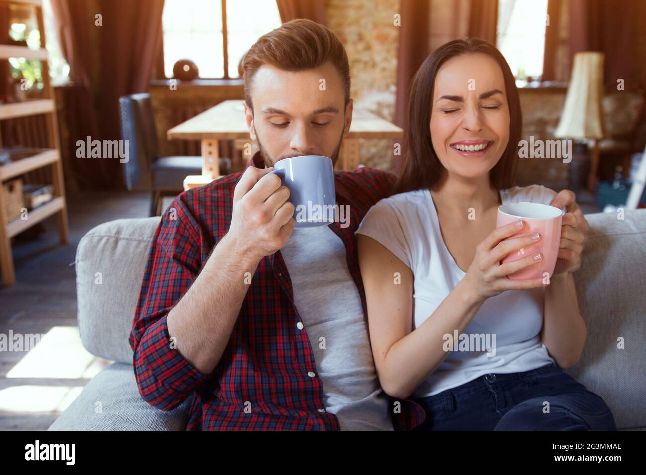 Lovely couple drinking coffee together Stock Photo - Alamy
