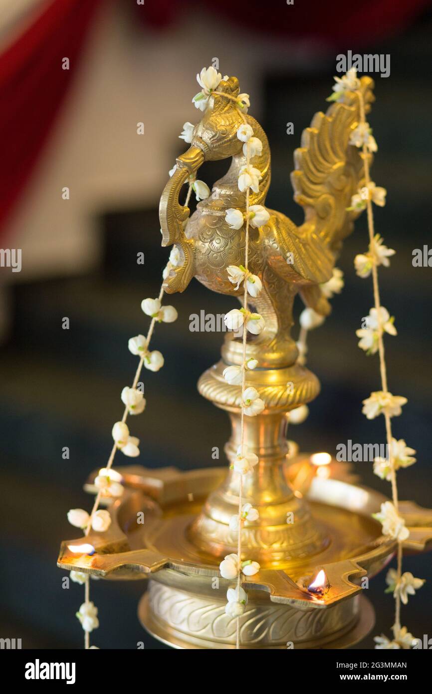 Samai oil lamp at a wedding in Malaysia Stock Photo - Alamy