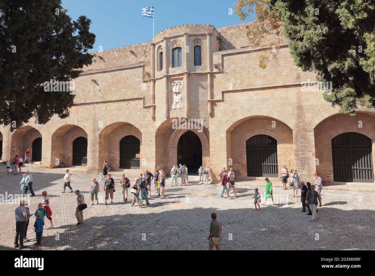 Tourists at the entrance to the Archaeological Museum of Rhodes located ...