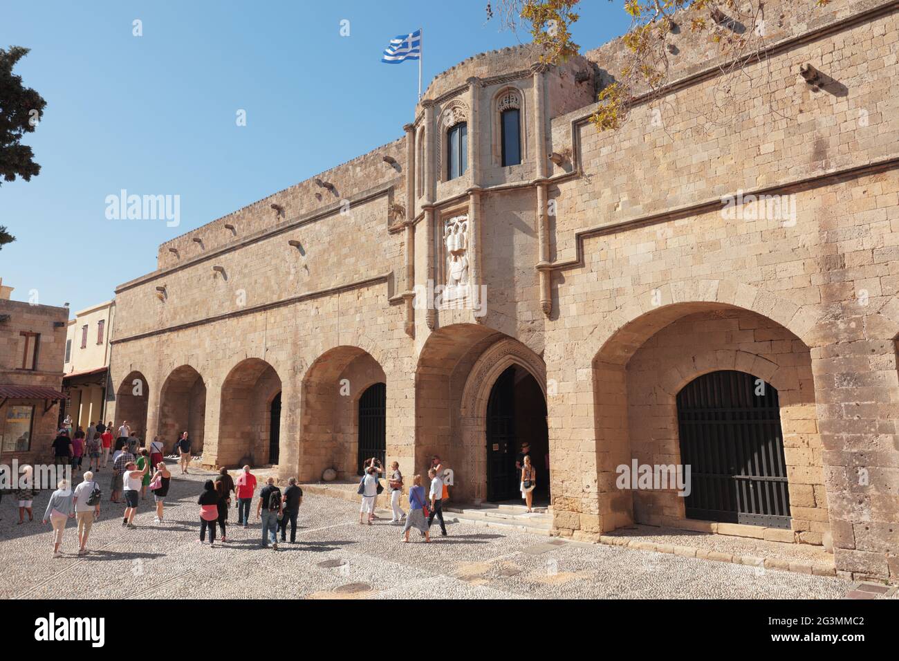 Tourists at the entrance to the Archaeological Museum of Rhodes located ...