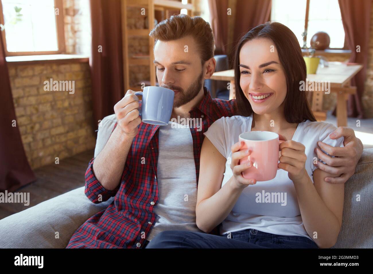 Lovely couple drinking coffee together Stock Photo - Alamy
