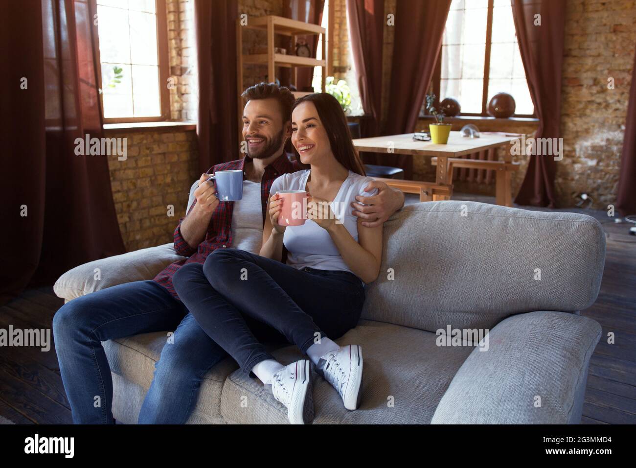 Lovely couple drinking coffee together Stock Photo - Alamy