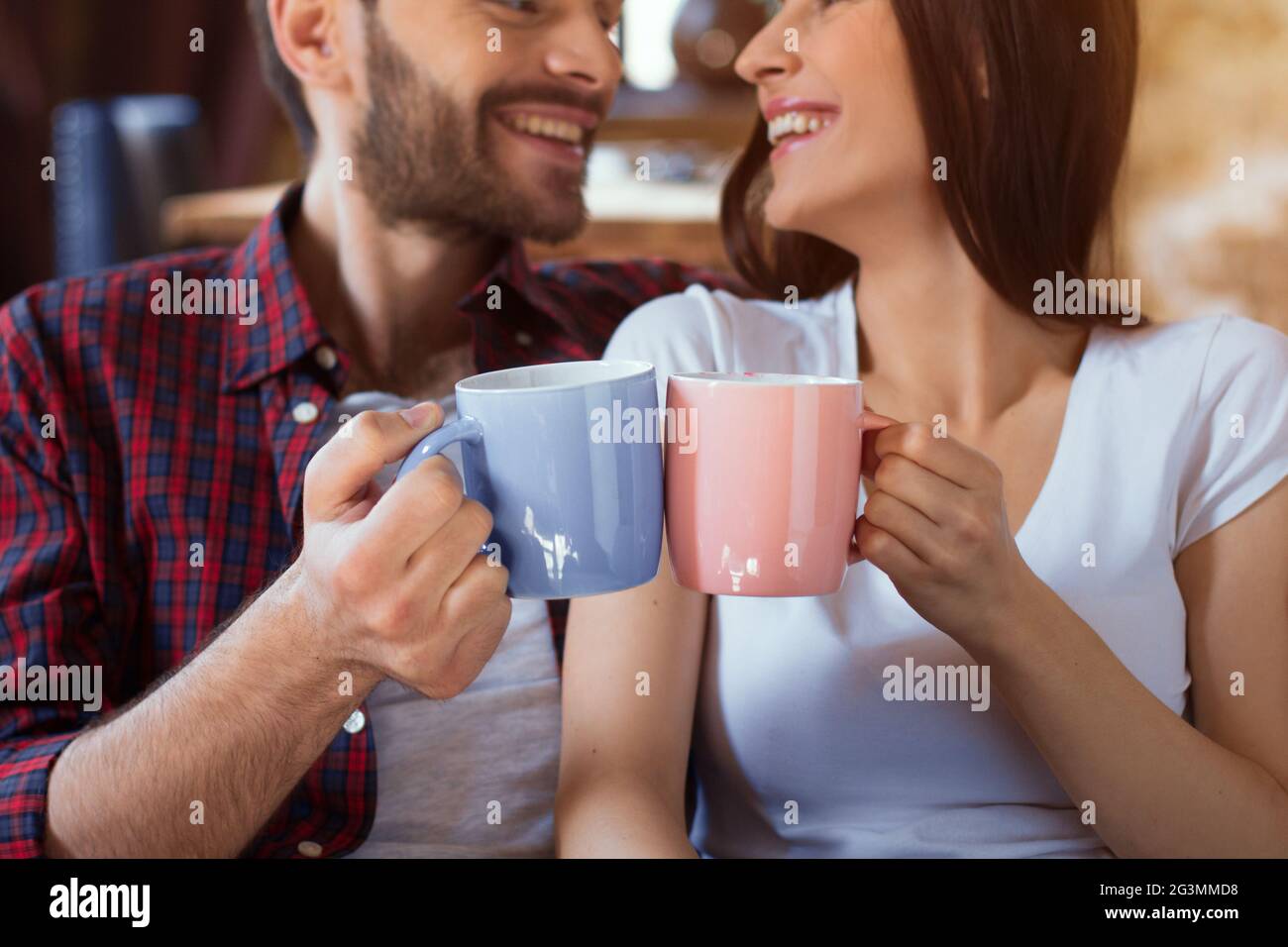 Lovely couple drinking coffee together Stock Photo - Alamy