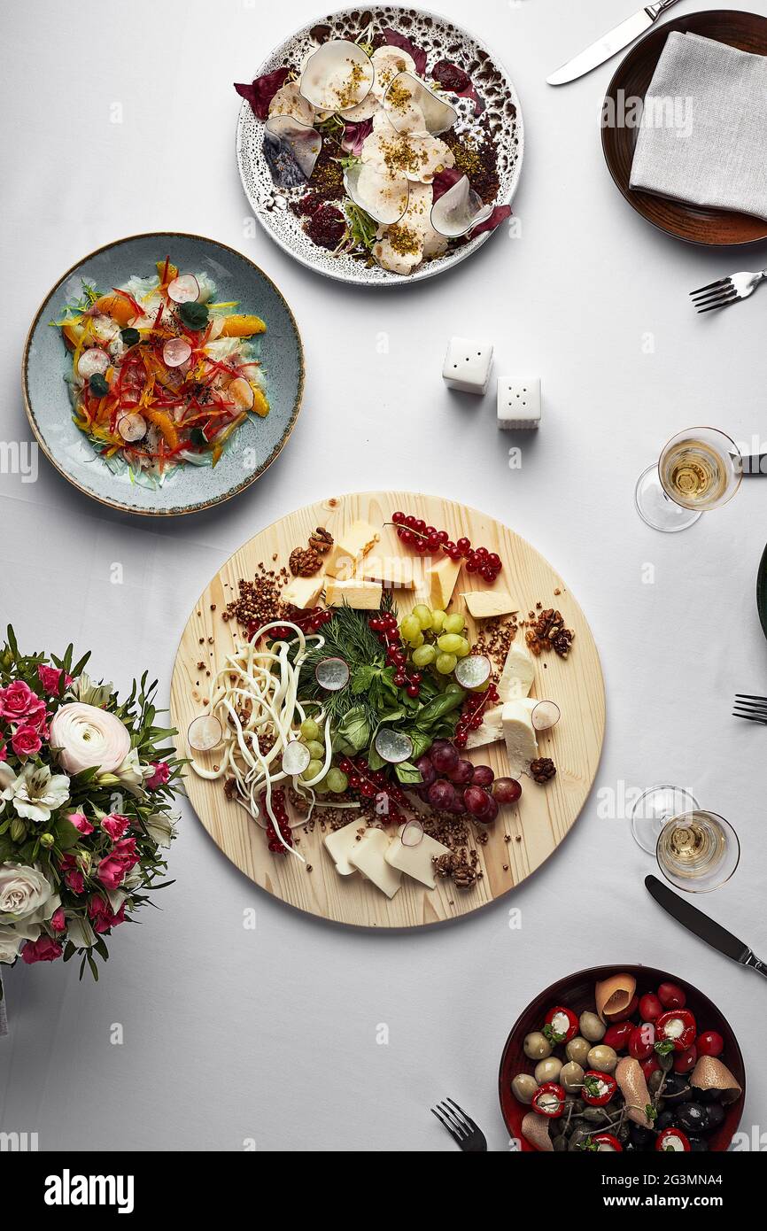 Assorted food, banquet table with snacks, Italian appetizers on a white ...