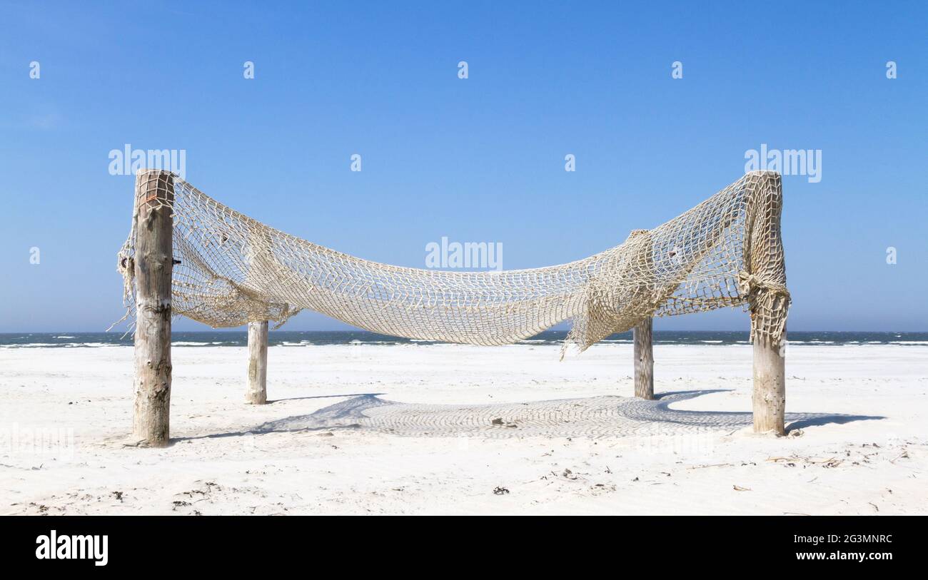 Fishnet on a beach Stock Photo - Alamy