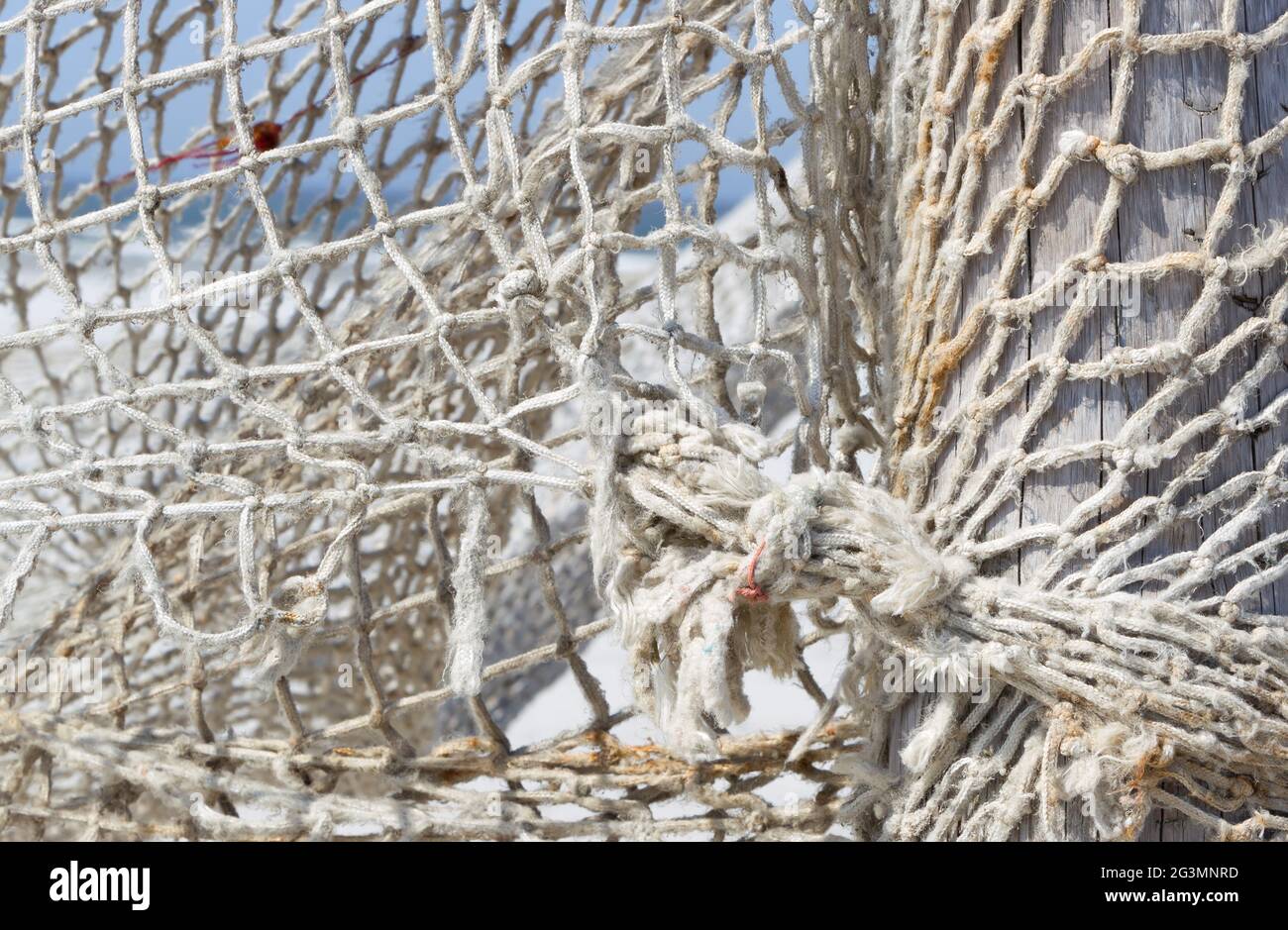 Fishnet on a beach Stock Photo - Alamy