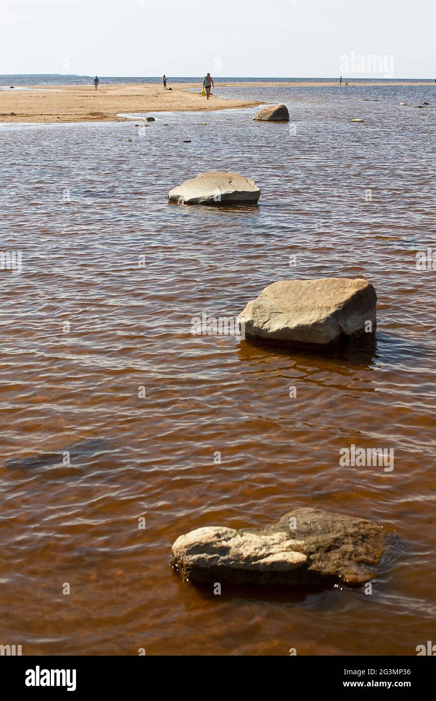 Four rocks by the long sand bank at the Kalajoki beach in the Northern ...