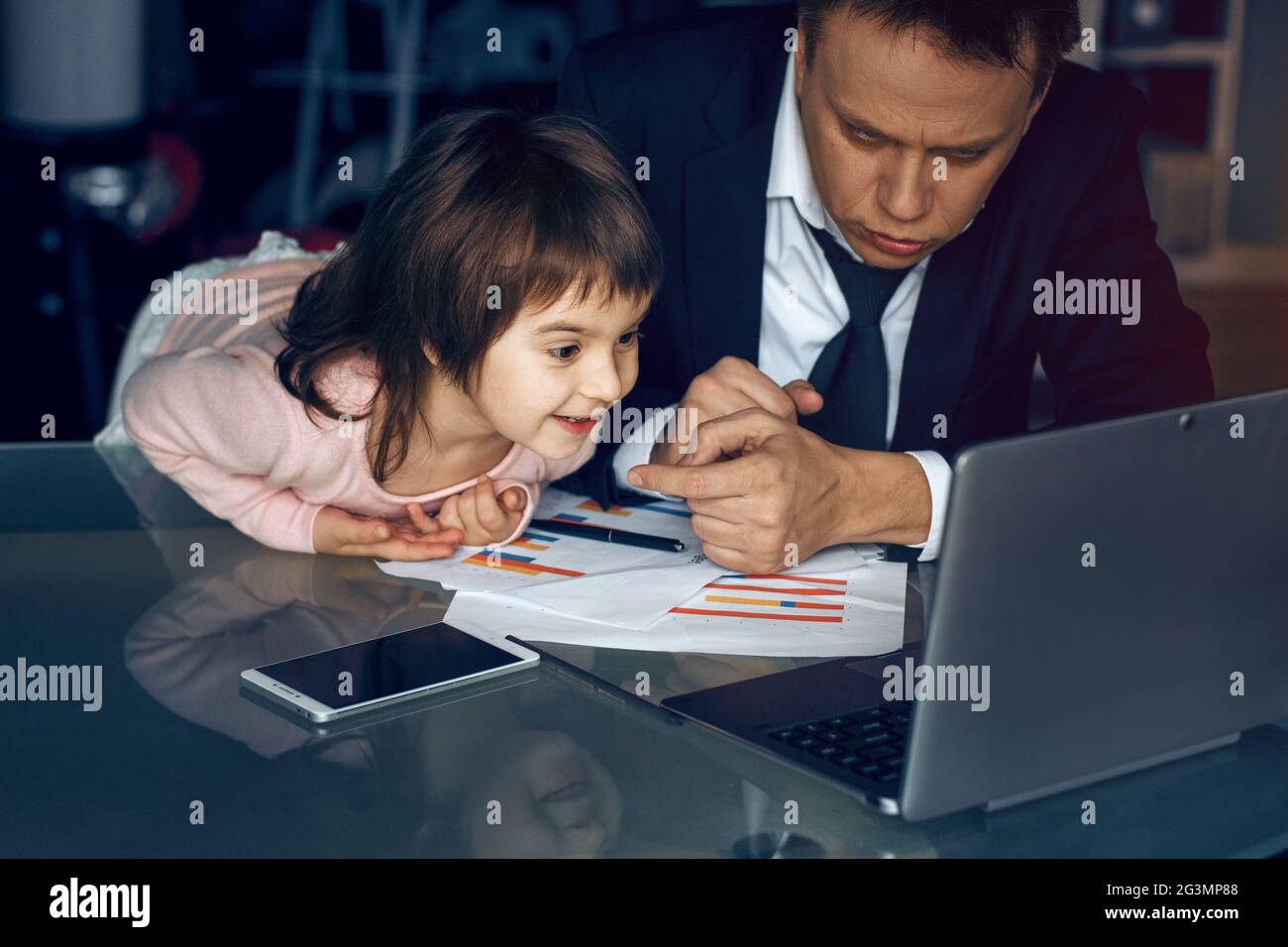 Daughter helping father work hi-res stock photography and images - Alamy