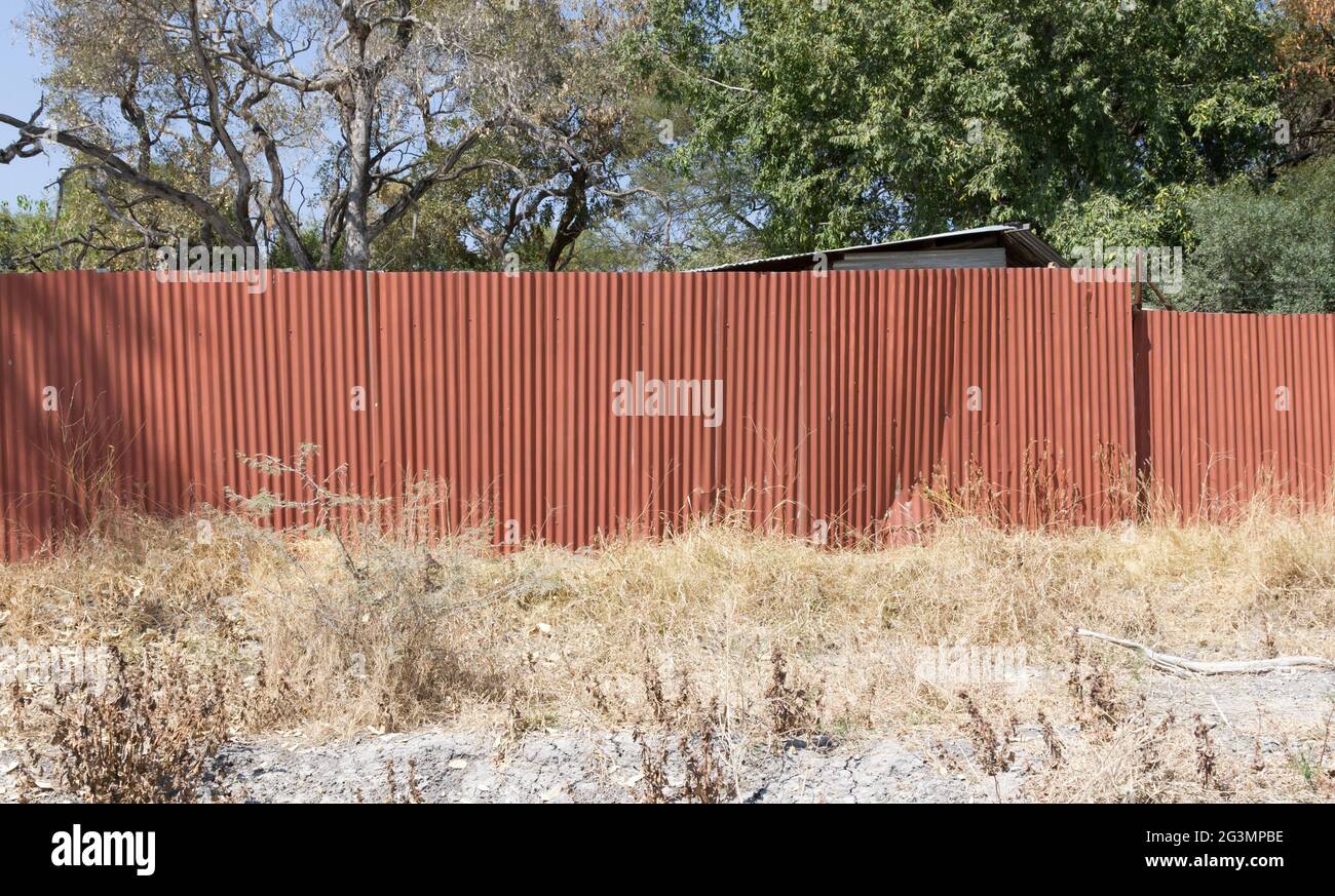Red metal fence Stock Photo - Alamy