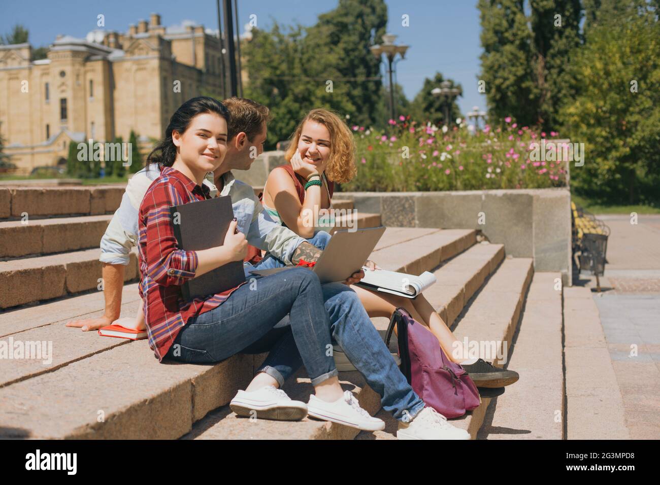 Three students on the stairs Stock Photo - Alamy