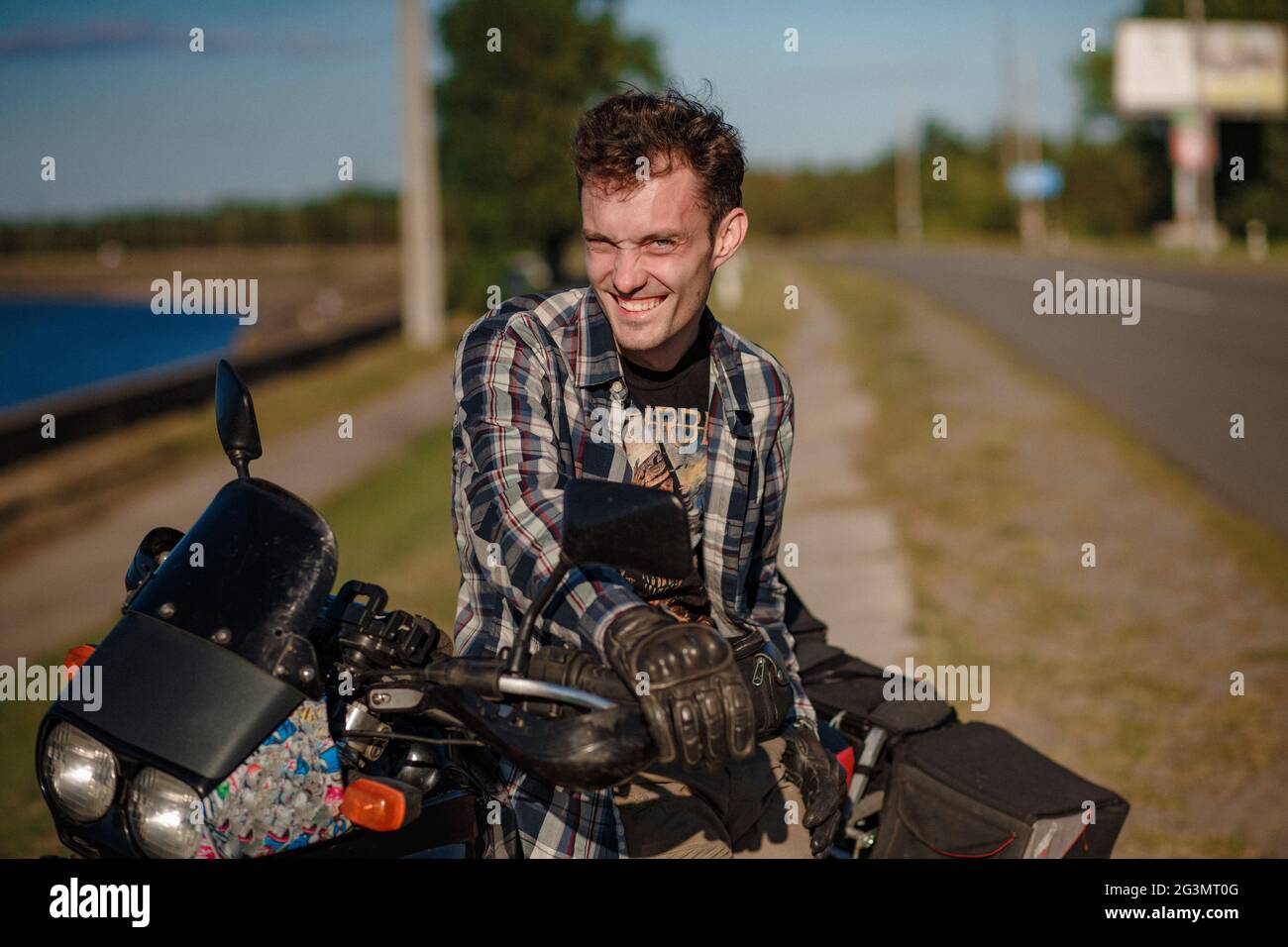 Young biker on his motorcycle Stock Photo - Alamy