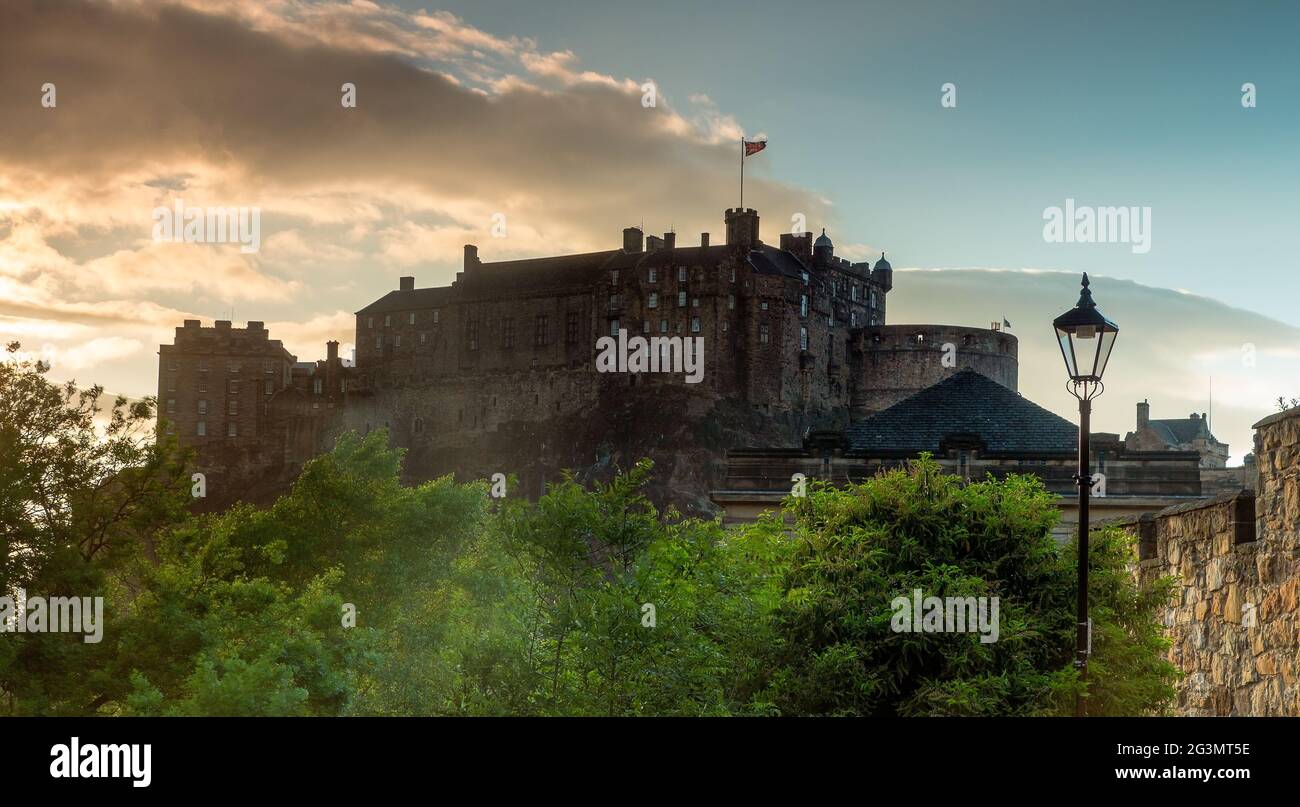Sunset over Edinburgh Castle which sits on top of an extinct volcano in ...