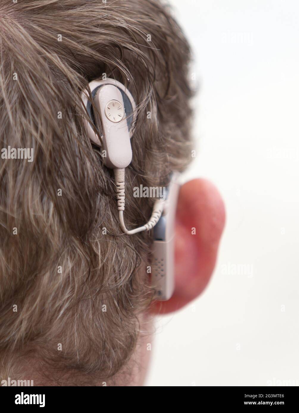 Bodyguard with in ear headset Stock Photo - Alamy
