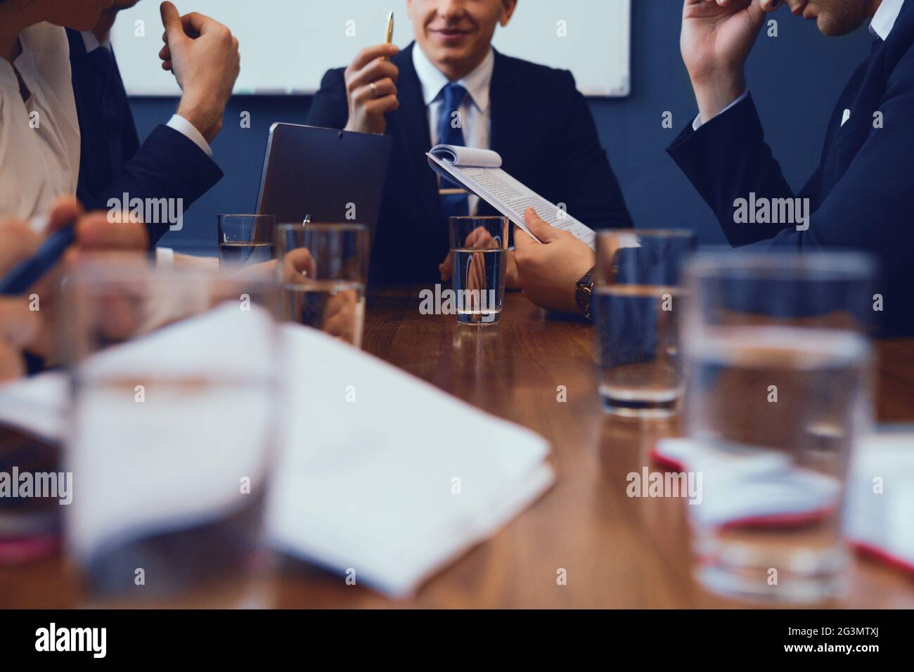 Group of business people having discussion Stock Photo - Alamy