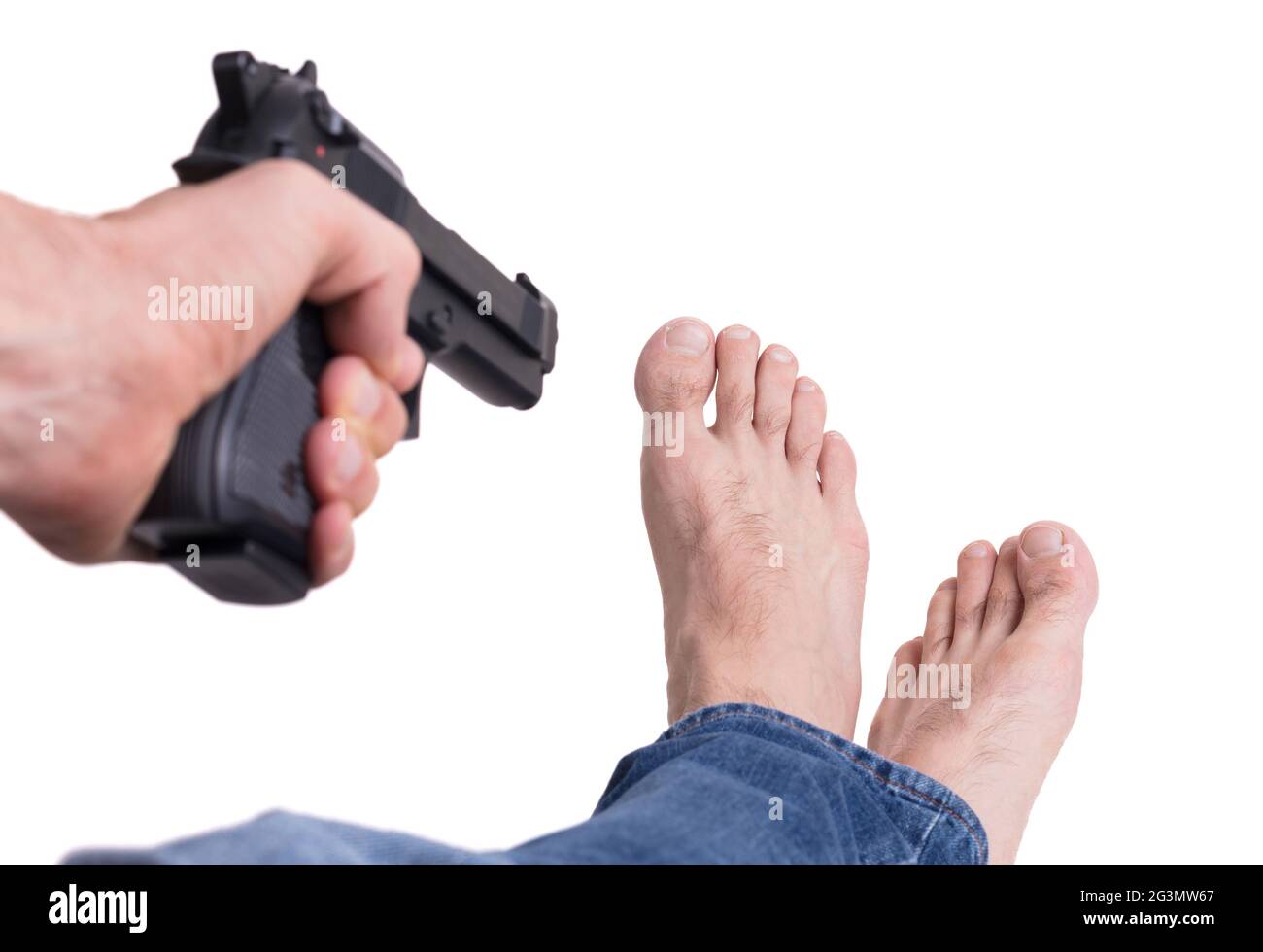 Man shooting himself in the foot Stock Photo - Alamy
