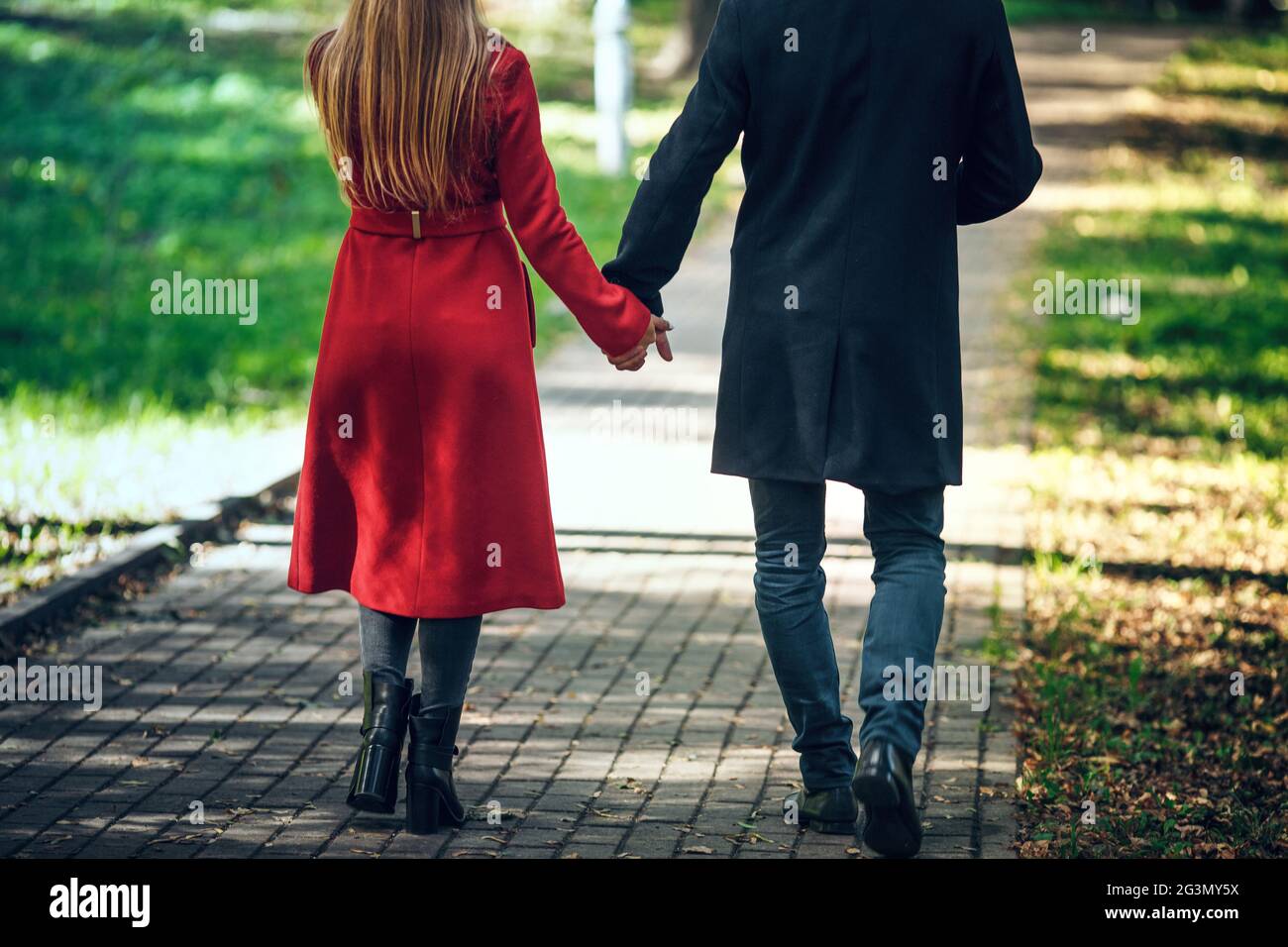 Couple walking hand in hand hi-res stock photography and images - Alamy